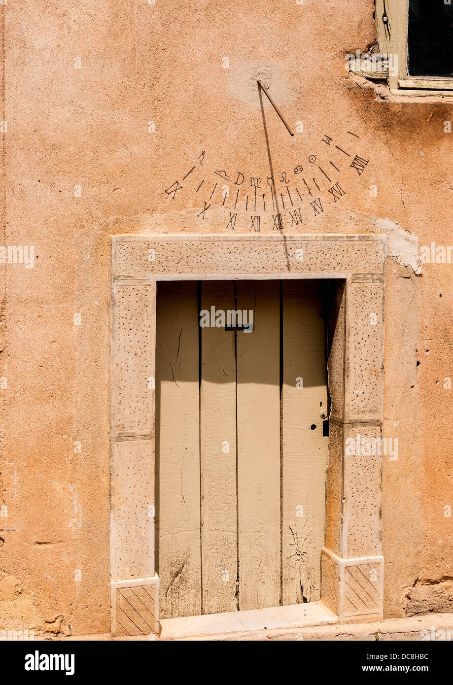 Sundial with Signs of Zodiac over Doorway Stock Photo - Alamy