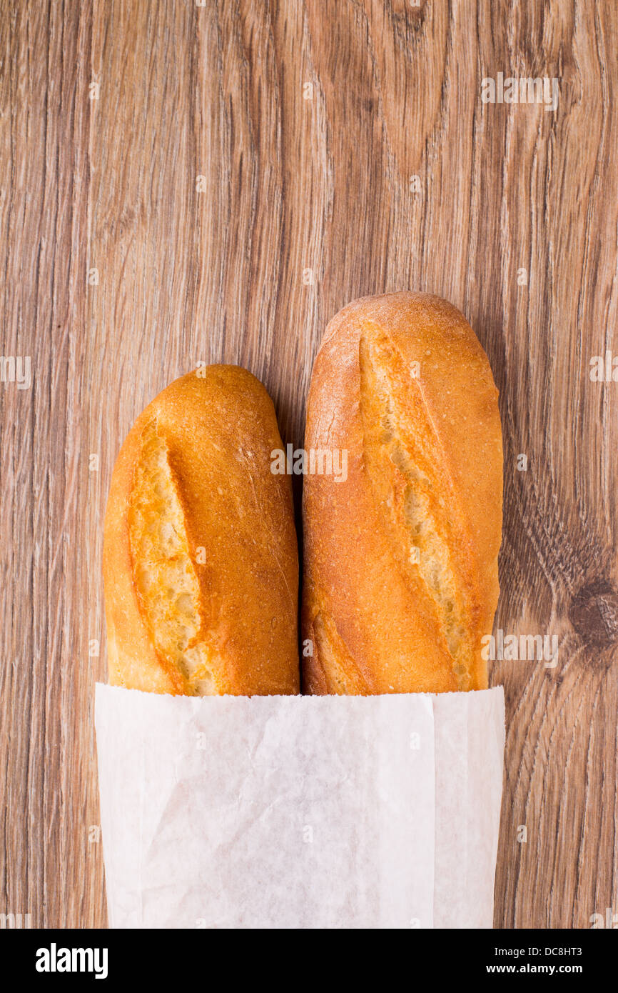 Baguette in paper bag Stock Photo - Alamy