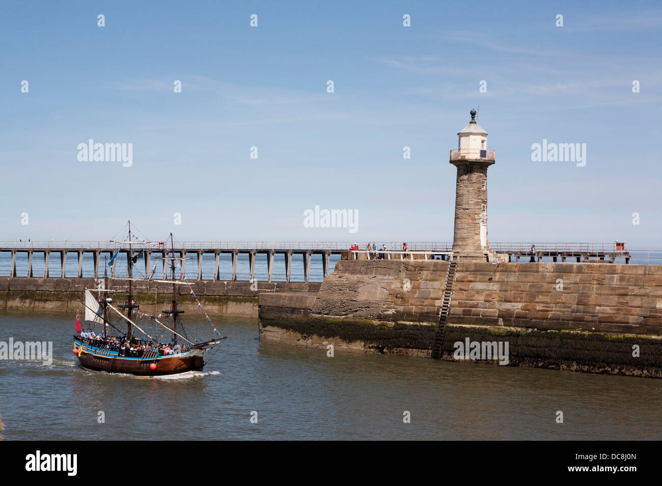 A small galleon style ship carrying passengers on the sea at Whitby bay ...