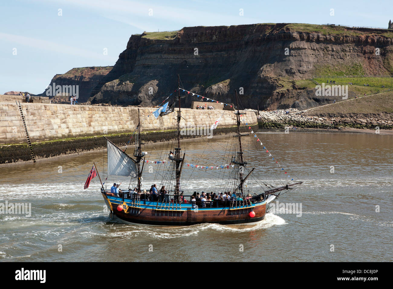 A small galleon style ship carrying passengers on the sea at Whitby bay ...