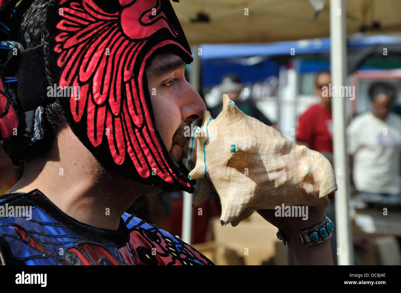 Man blowing conch shell hi-res stock photography and images - Alamy