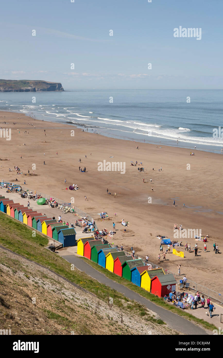 Whitby bay's brightly coloured beach huts and sandy bay/beach Stock ...