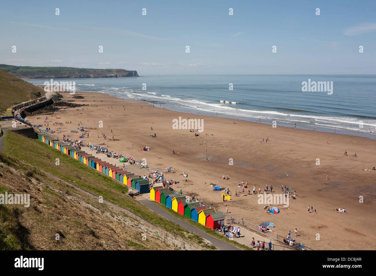 Whitby bay's brightly coloured beach huts and sandy bay/beach Stock ...