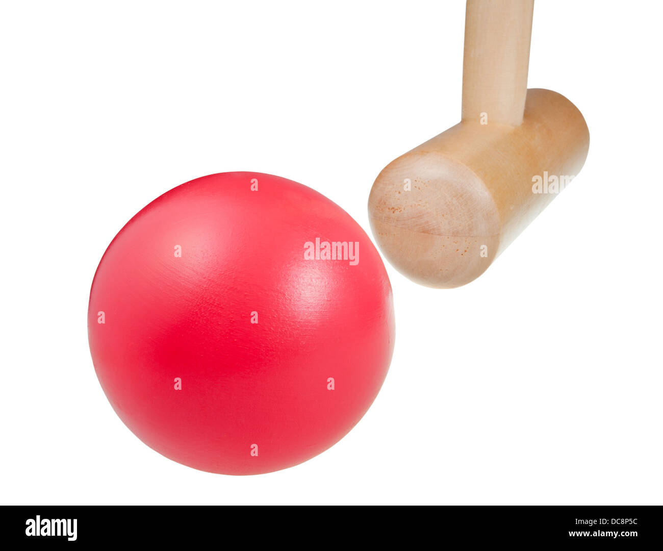 hitting red ball by wooden mallet in croquet game close up isolated on ...