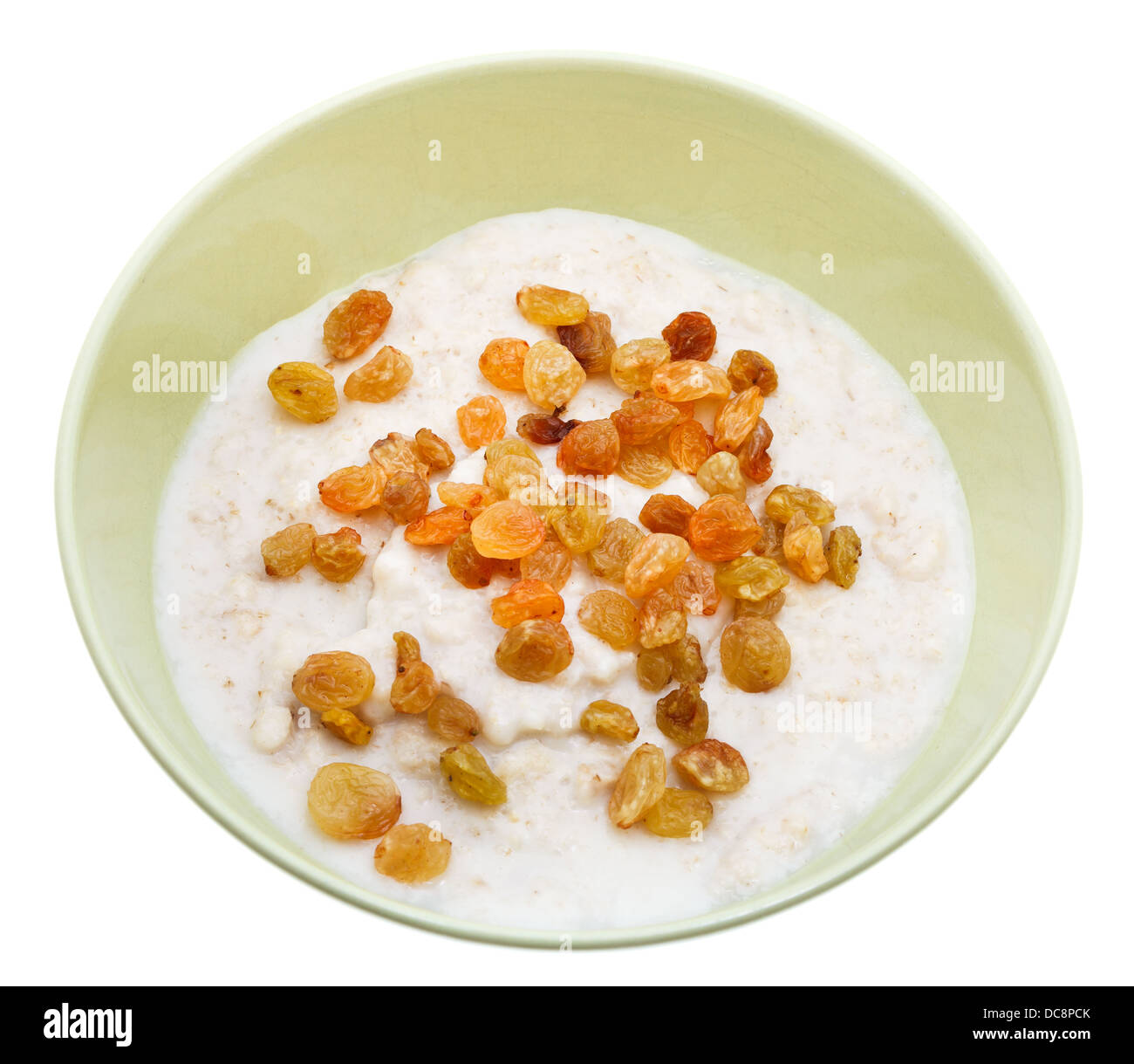 traditional english oat porridge with raisins in ceramic bowl isolated ...