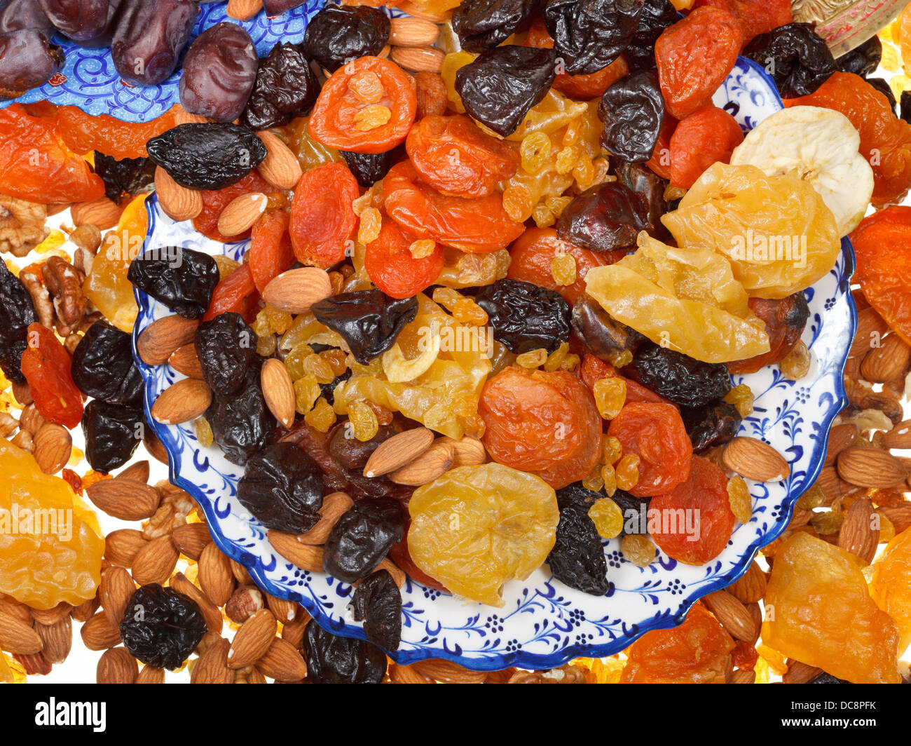 top view of many dried fruits on asian plates close up Stock Photo - Alamy