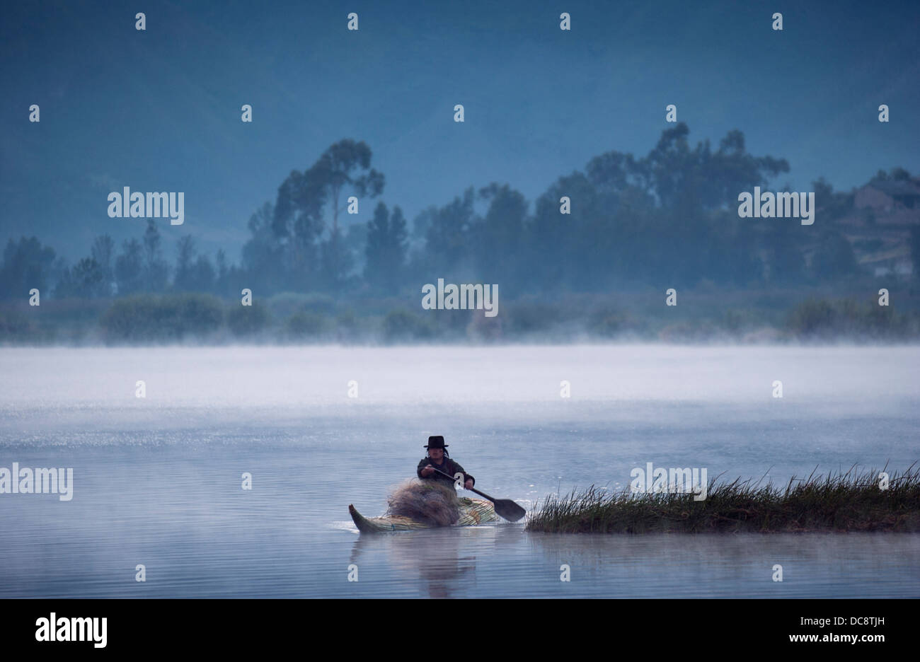 Otavalo Indian Fisherman using Tradition Reed Boat, Lake San Pablo near ...
