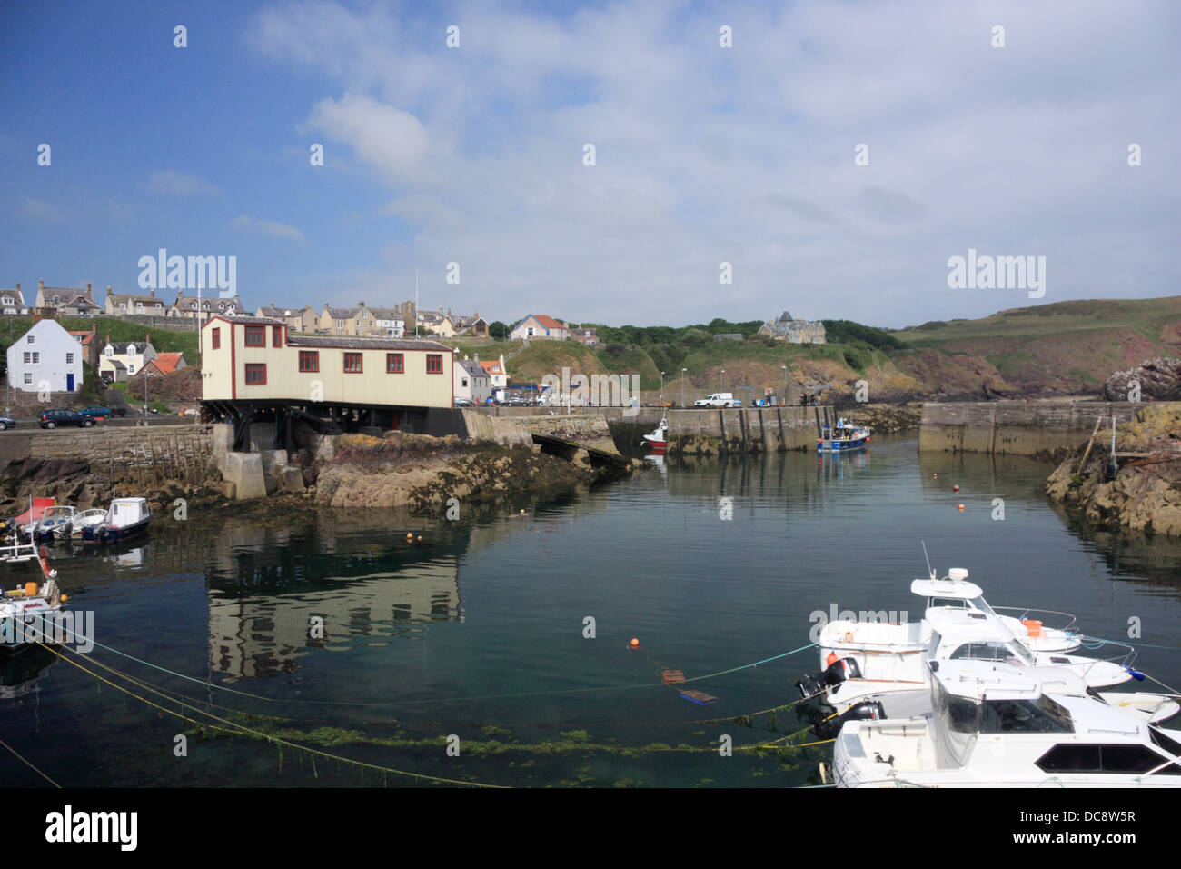 St Abbs harbour showing the RNLI lifeboat station & boats in the ...