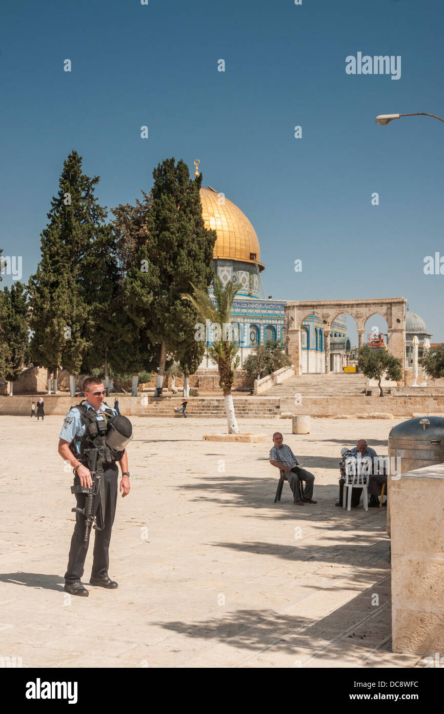 Jerusalem. A Israeli policeman and Arabs at the Temple mount. The ...