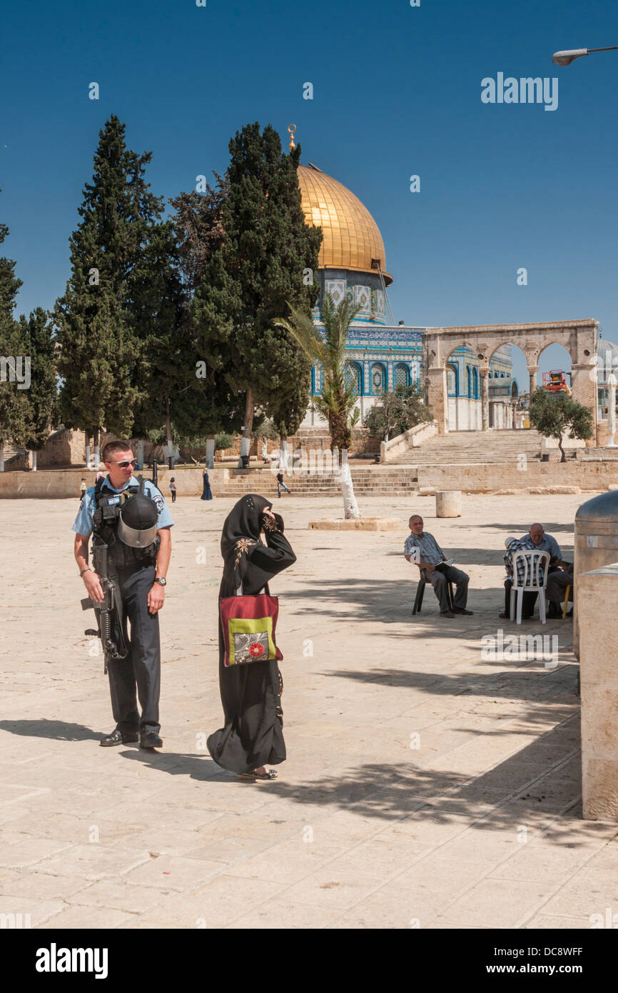Jerusalem. A Israeli policeman and Arabs at the Temple mount. The ...