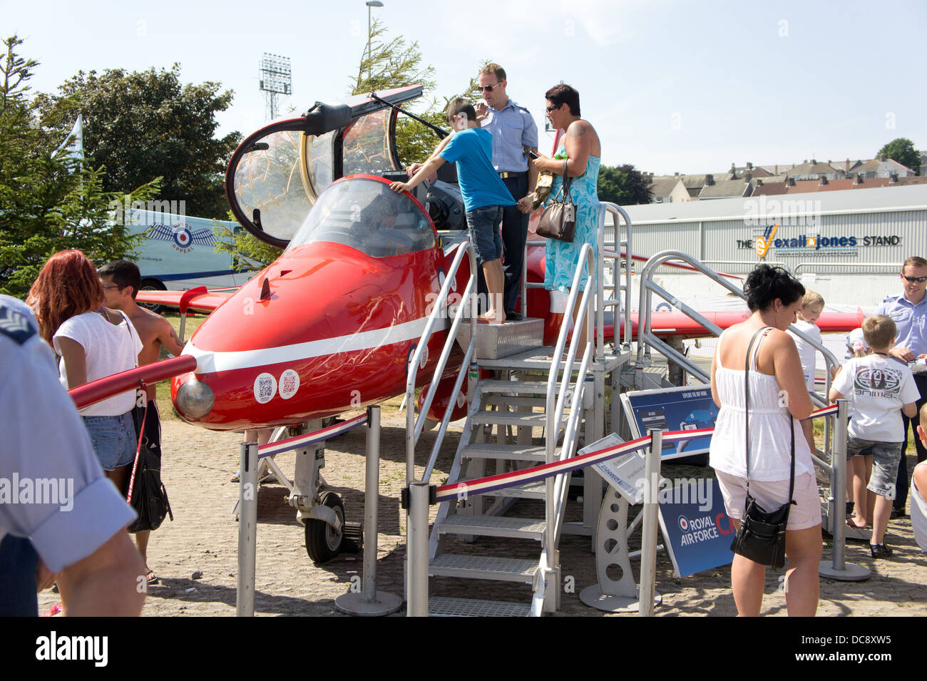 People viewing the interior of the cockpit of a red arrows display ...