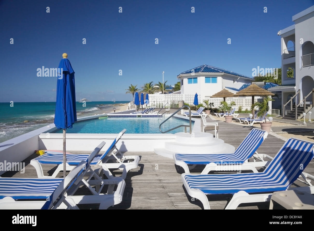 Swimming pool at a tropical resort on the water's edge, Simpson Bay ...