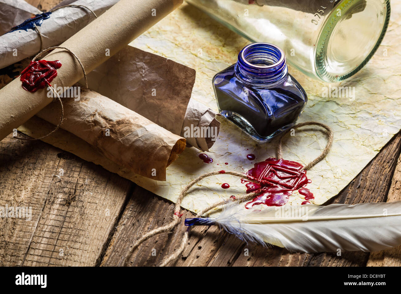 Vintage desk full of old scrolls scribe and blue ink Stock Photo - Alamy