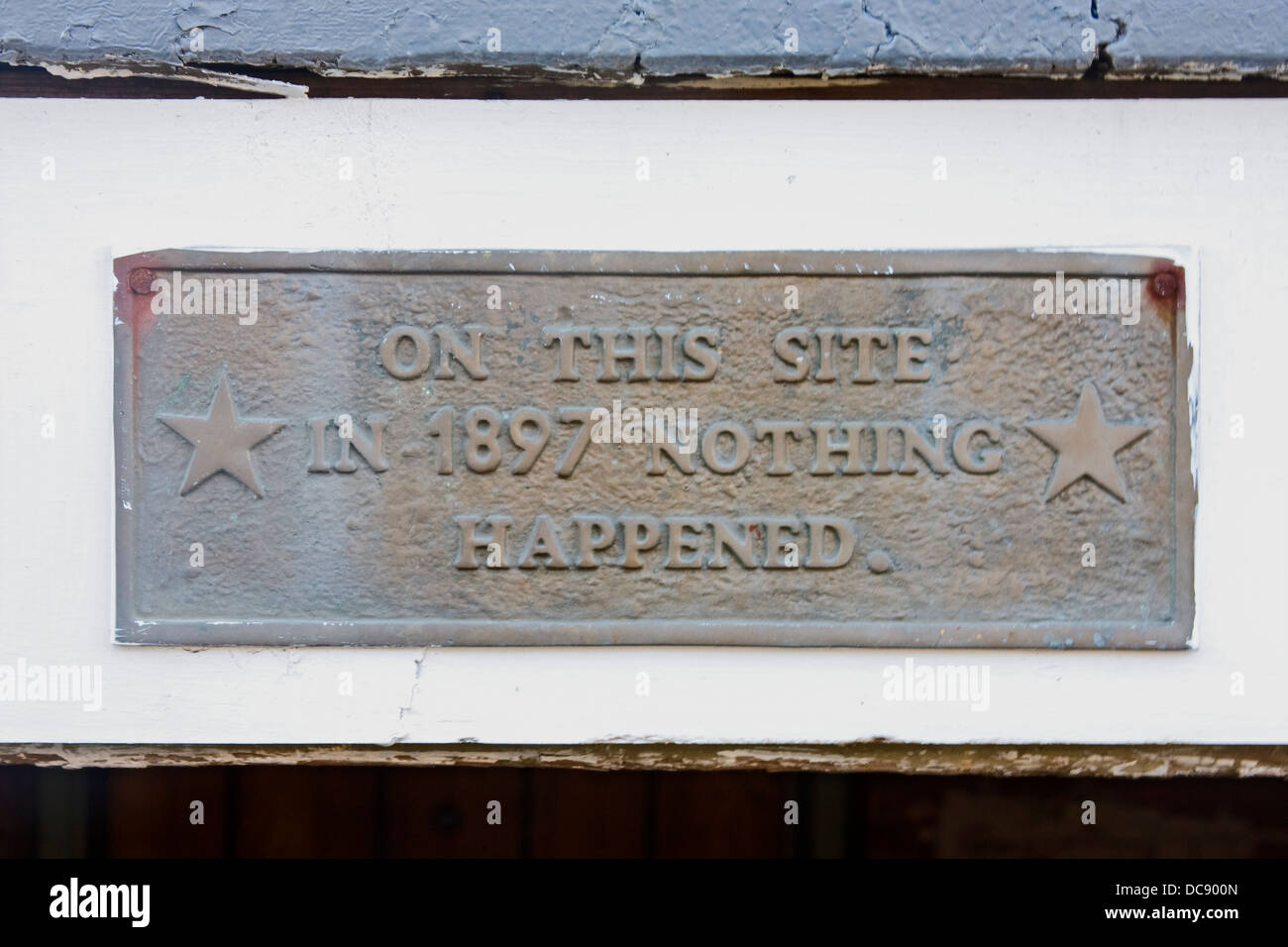 "On This Site in 1897 Nothing Happened." historic sign on a wooden ...