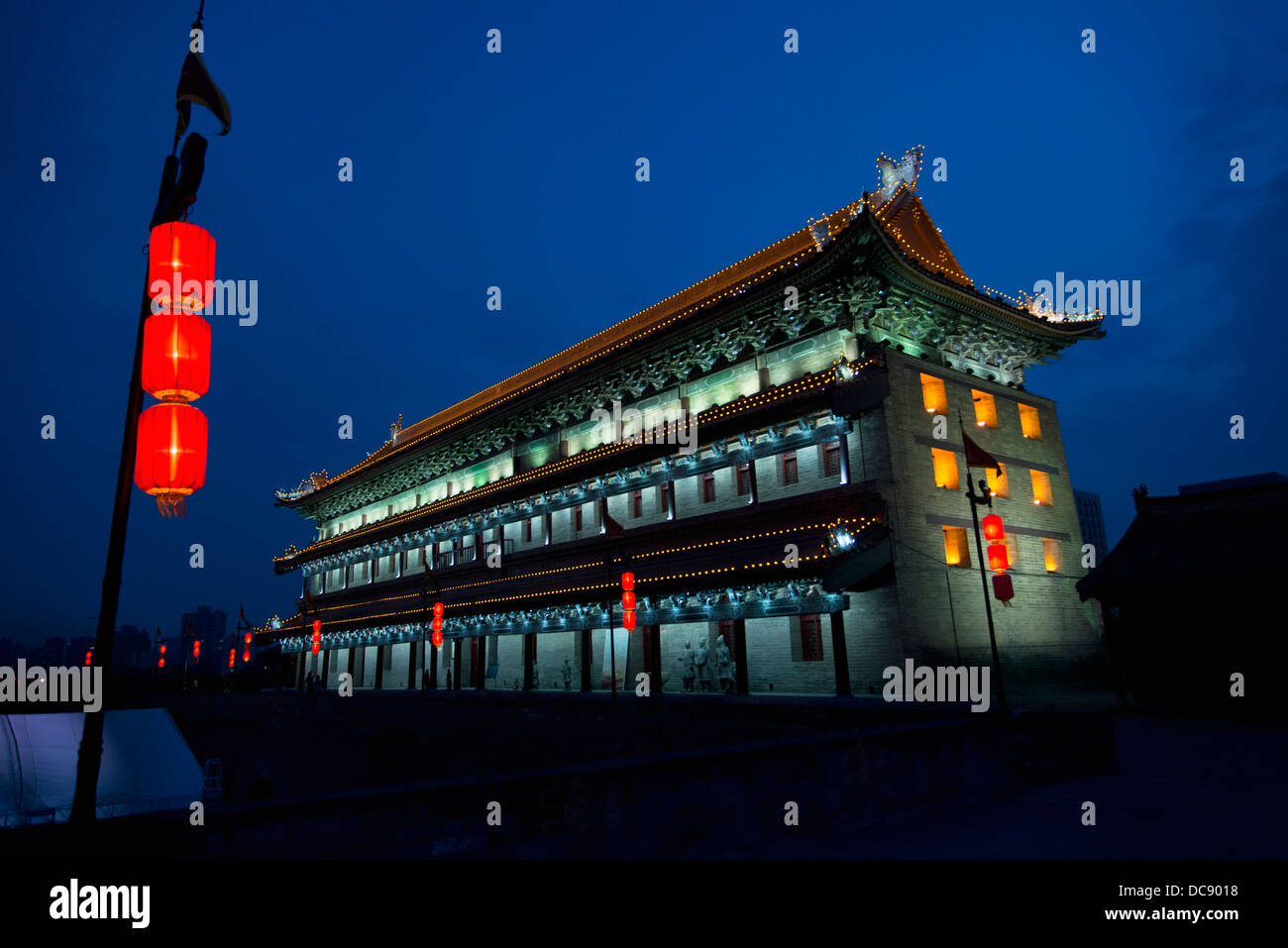 A building illuminated at night along the Lianhu Ancient City Wall; Xi ...