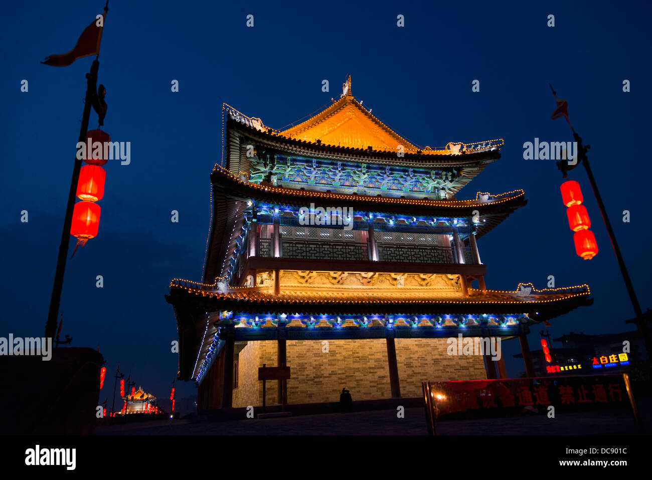 A building illuminated at night along the Lianhu Ancient City Wall; Xi ...