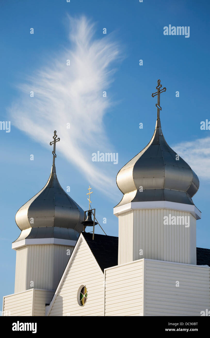 Twin steeples on a ukrainian orthodox church with blue sky and clouds ...