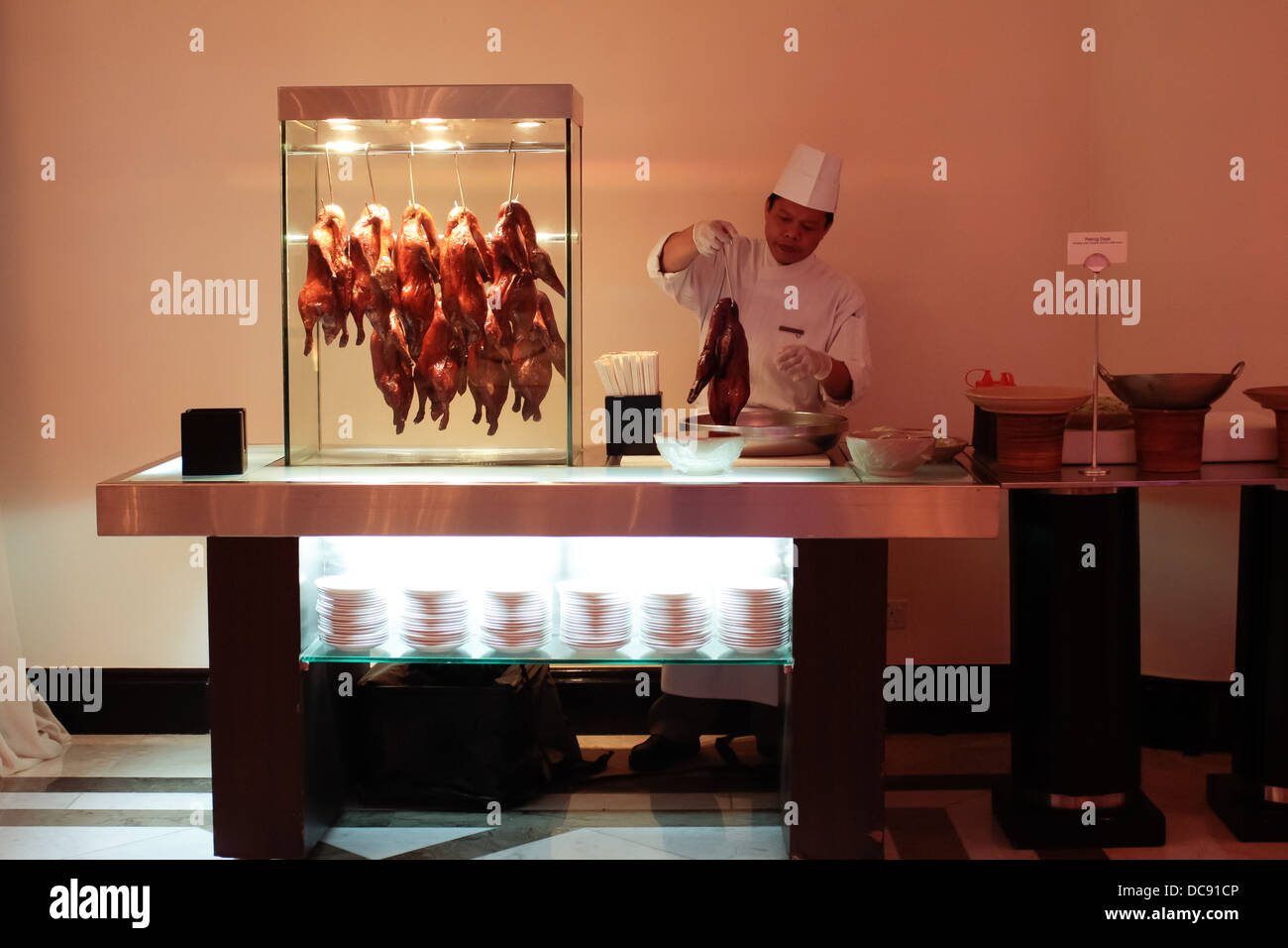 Chef preparing Peking Duck stall on a wedding party reception Stock ...