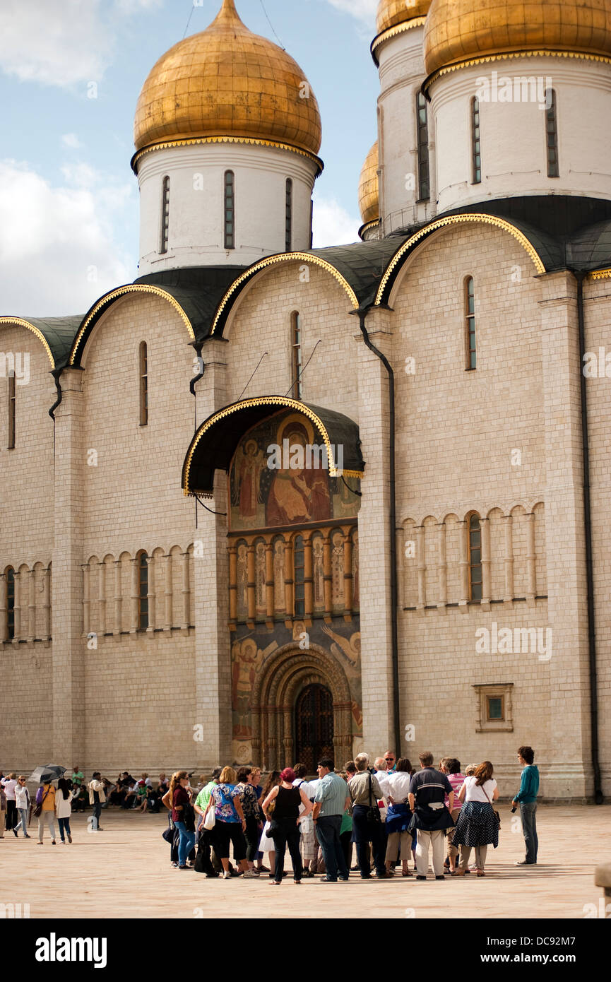 Tourist groups visiting Kremlin in front of Assumption Cathedral of the ...