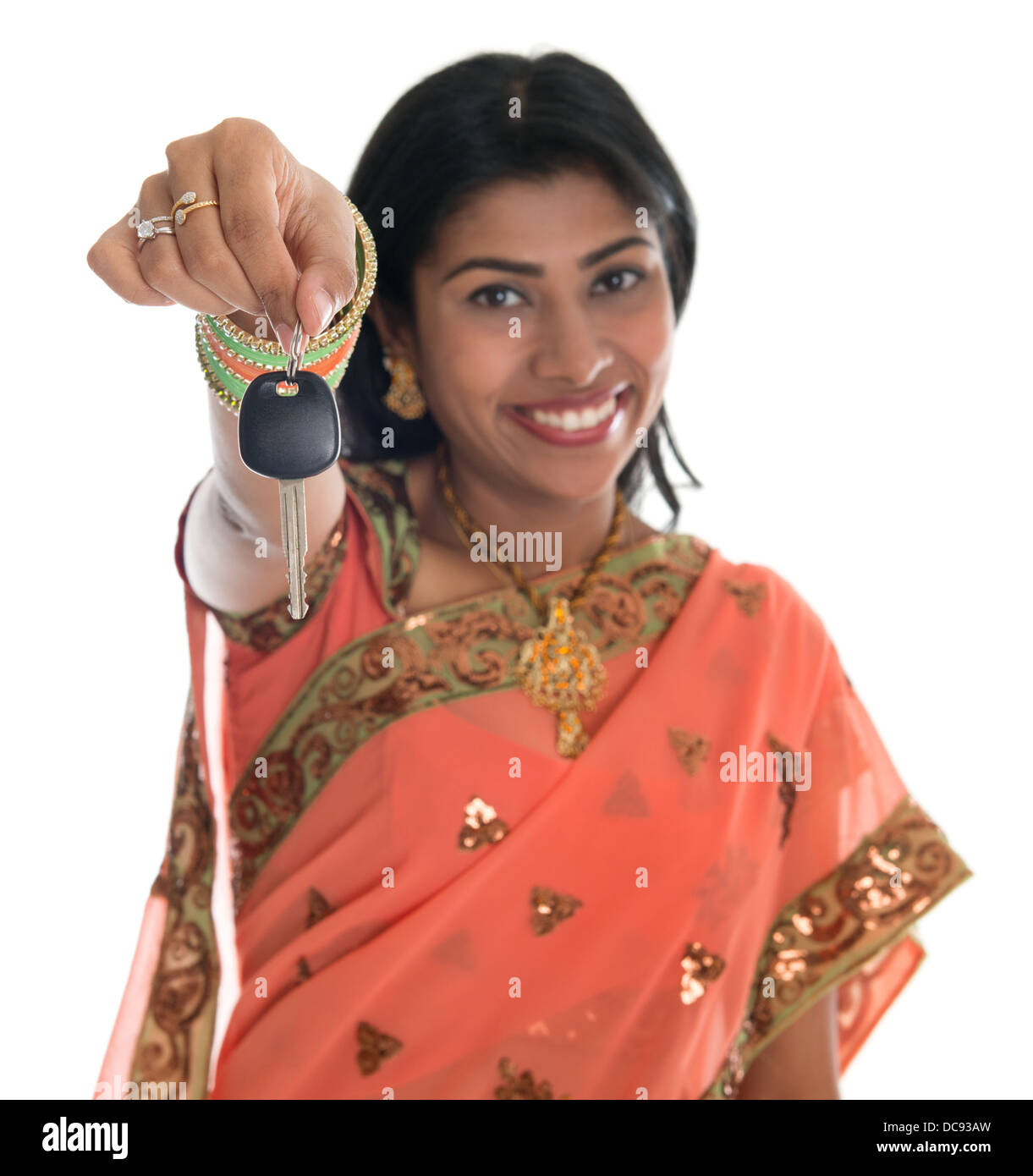 Attractive traditional Indian woman in sari holding her first own car ...