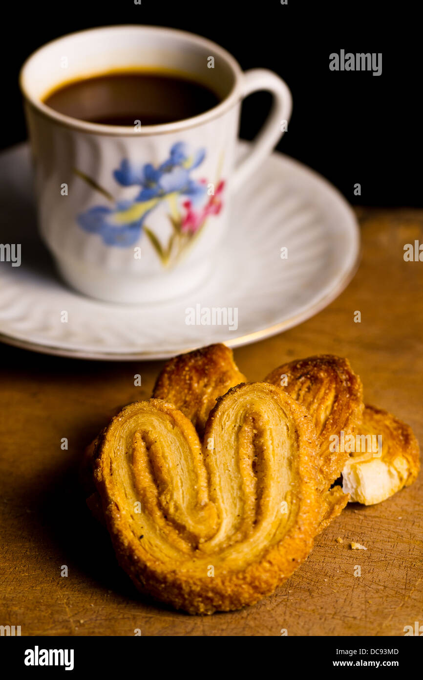 Picture of a cup of coffee and a piece of fine pastry Stock Photo - Alamy