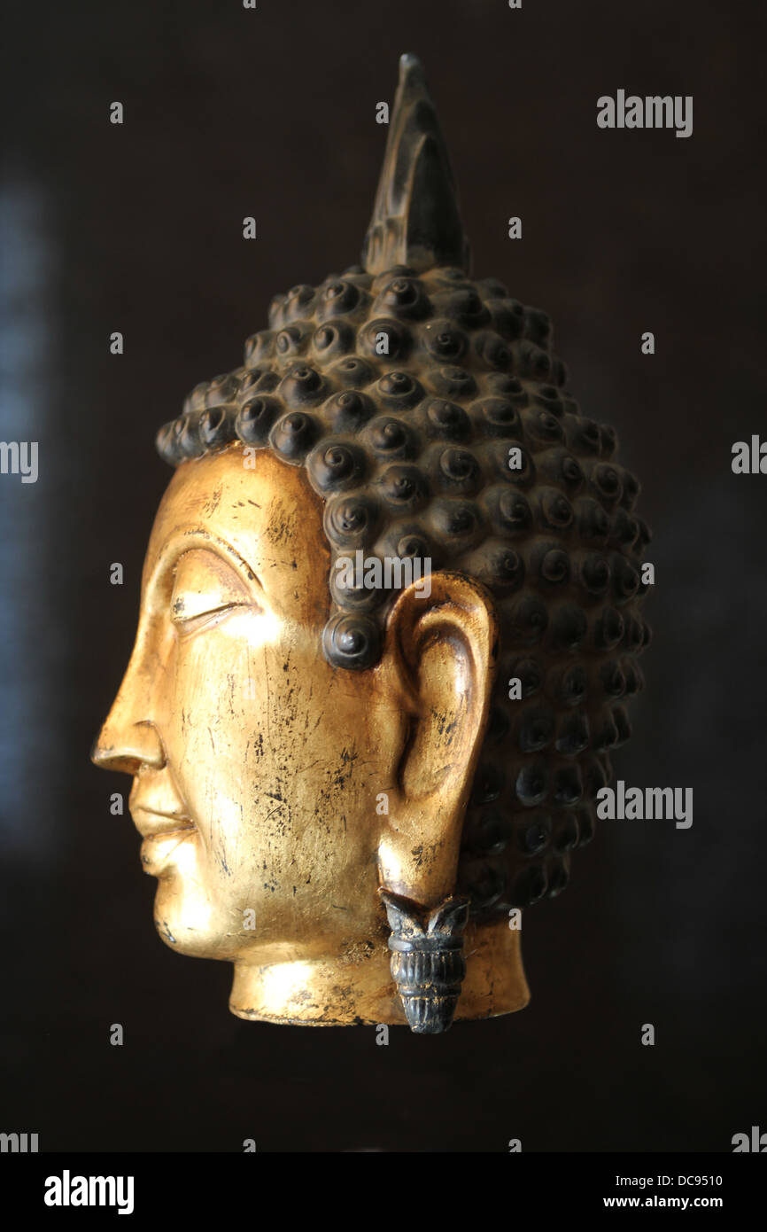 Buddha head, side view Stock Photo - Alamy