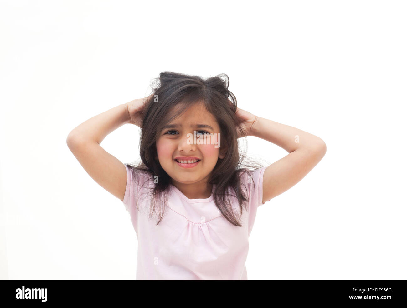 Portrait of young girl scratching her head Stock Photo - Alamy