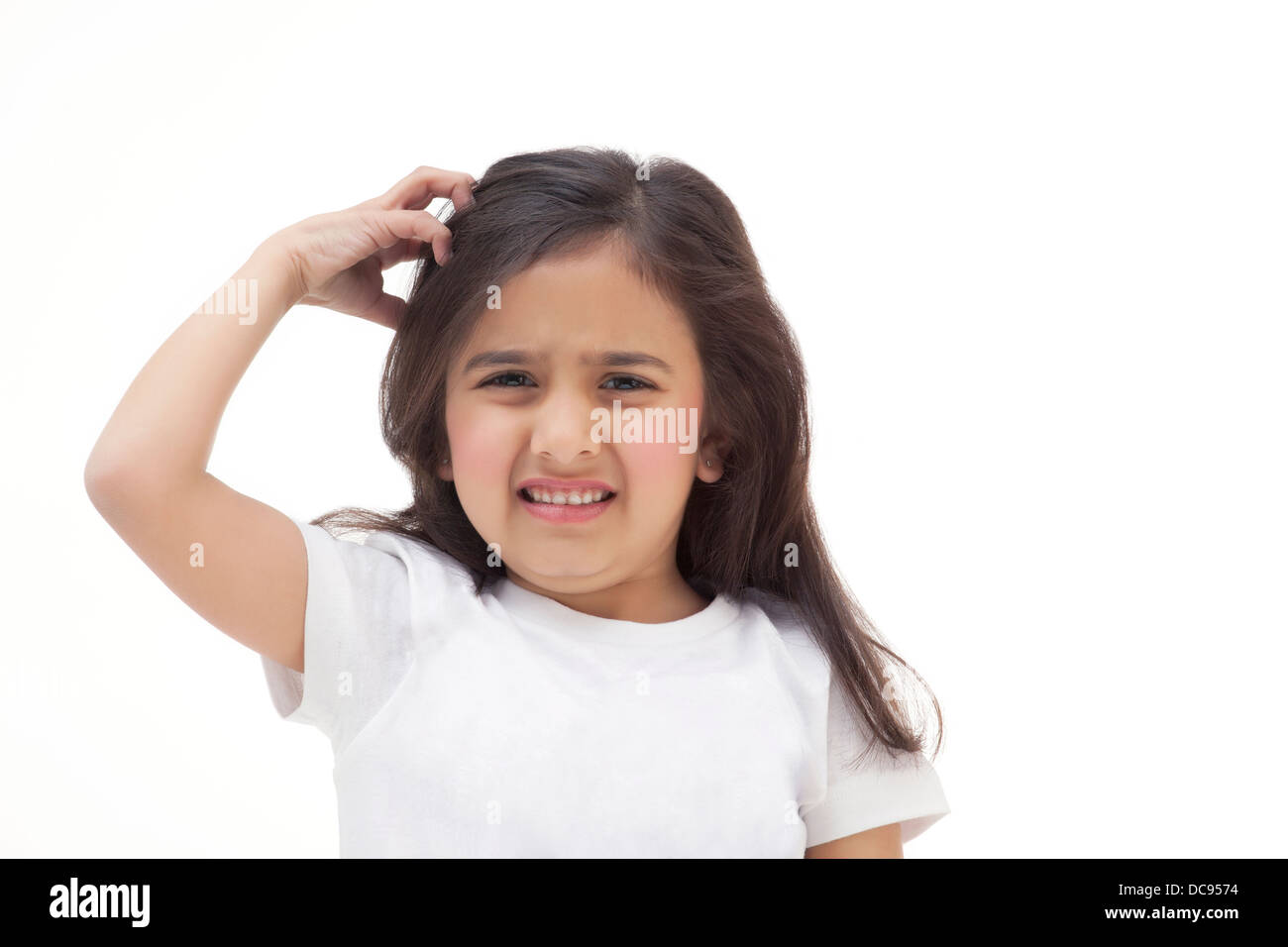 Portrait of young girl scratching her head Stock Photo - Alamy