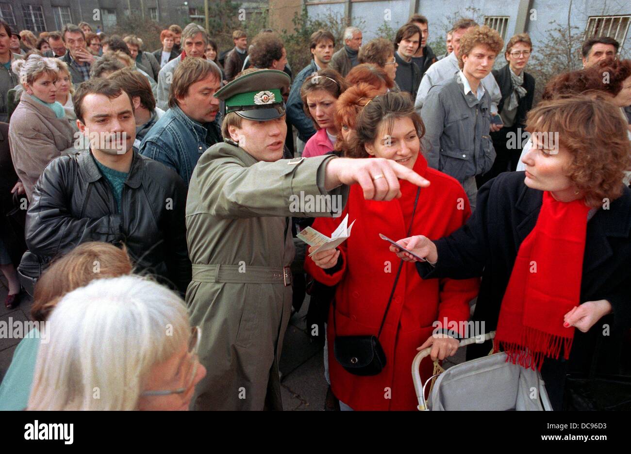 A friendly GDR policeman gives directions to a group of women at a ...