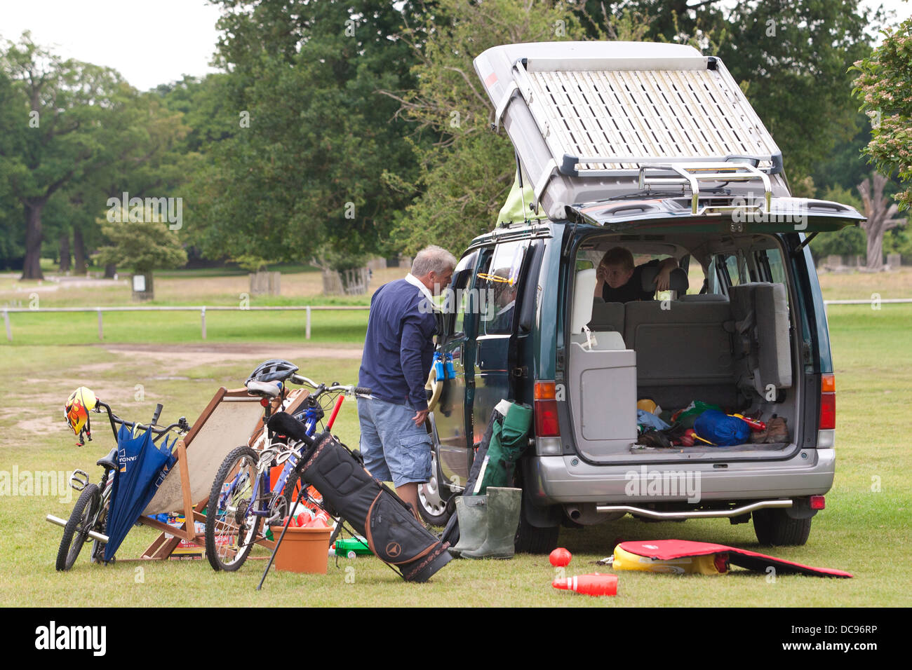 Father and son with their modern camping van Stock Photo - Alamy