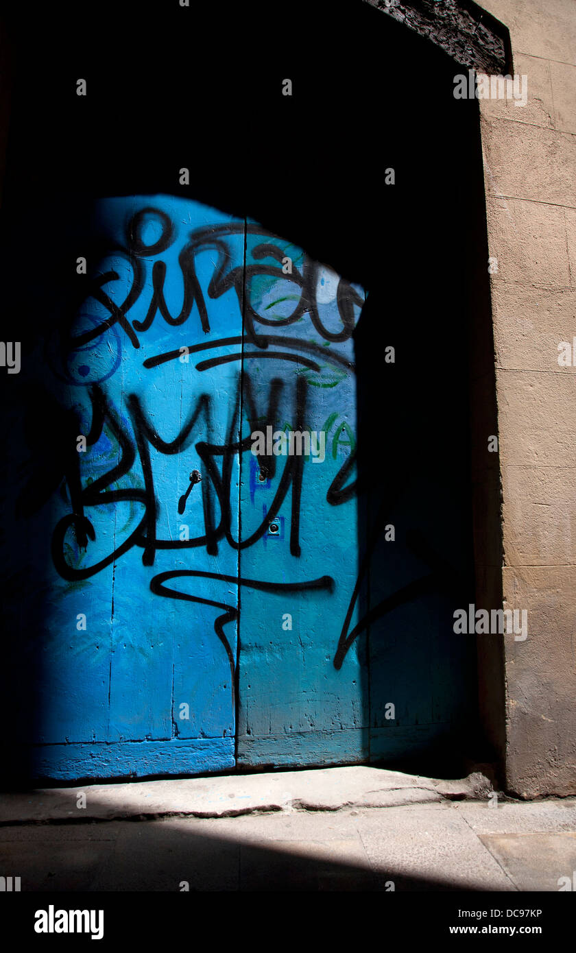 Blue door with graffiti, Barcelona, Spain Stock Photo - Alamy