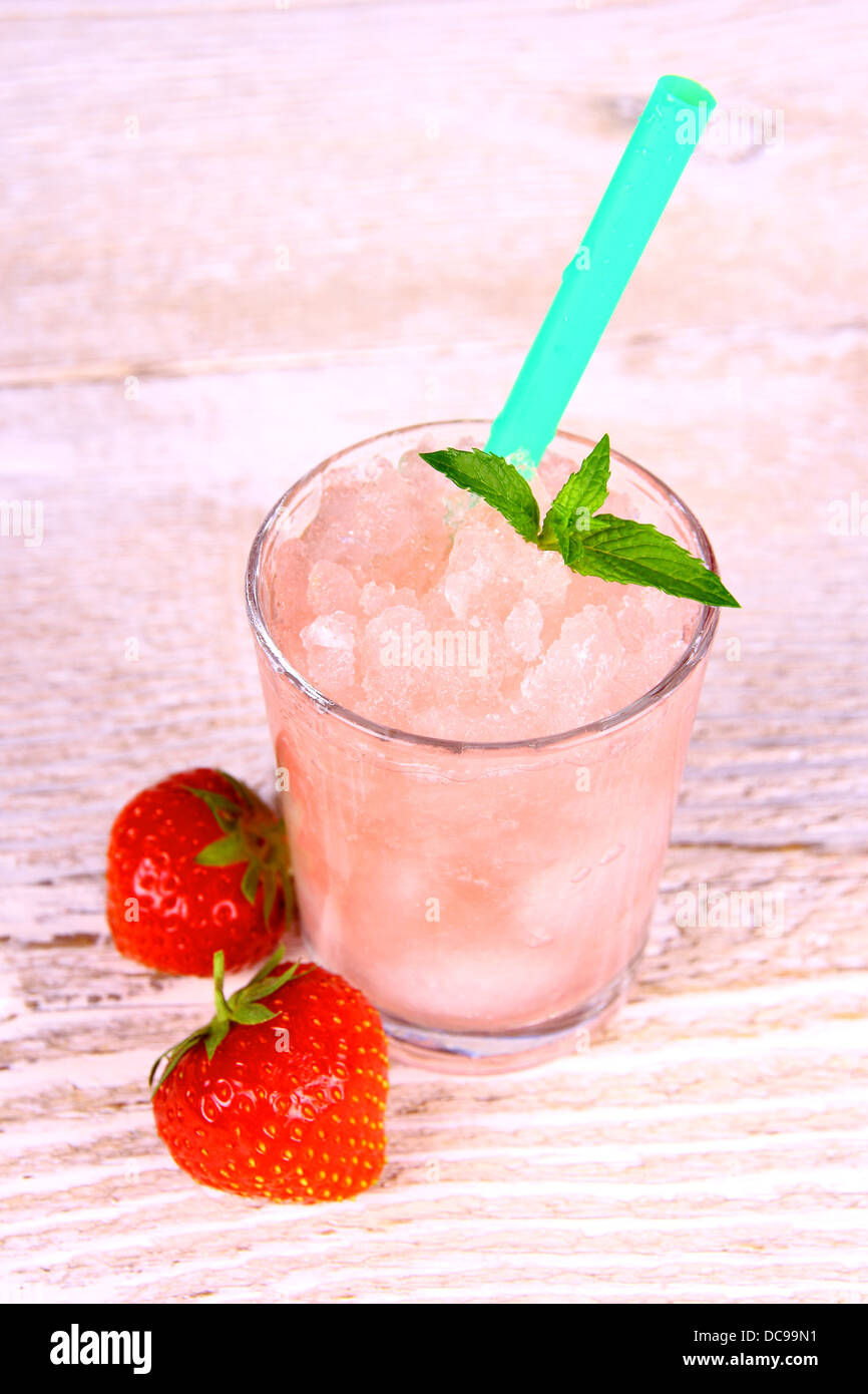 Strawberry slush in glass with straw and mint, top view Stock Photo - Alamy