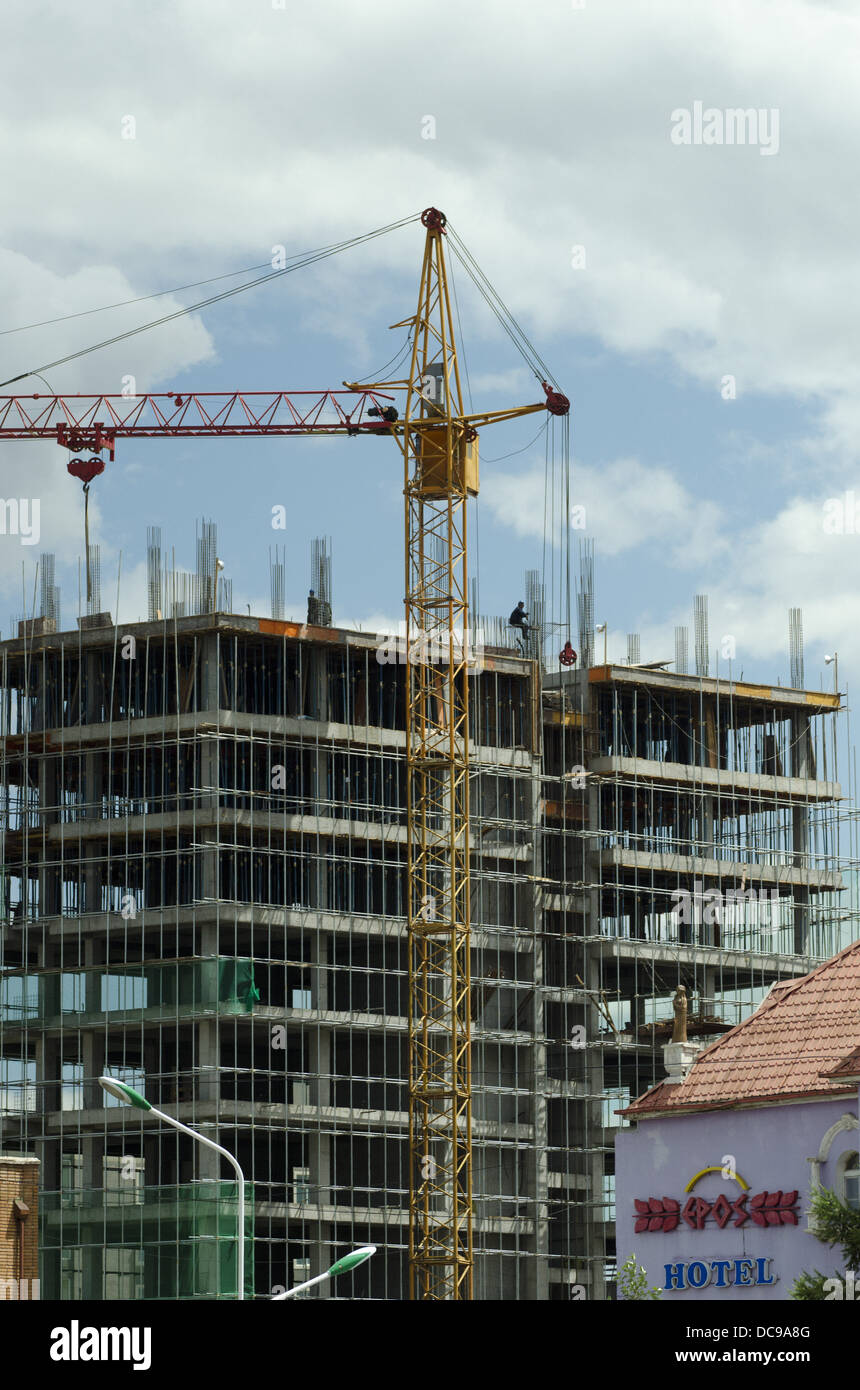Workers on a high rise construction project of residential and ...