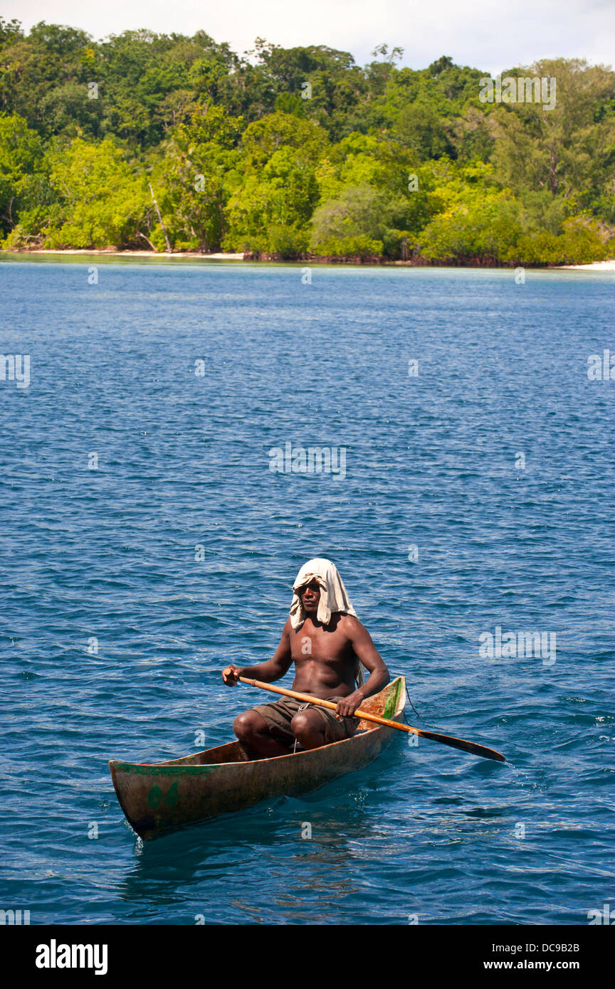 Man paddling in his canoe Stock Photo - Alamy