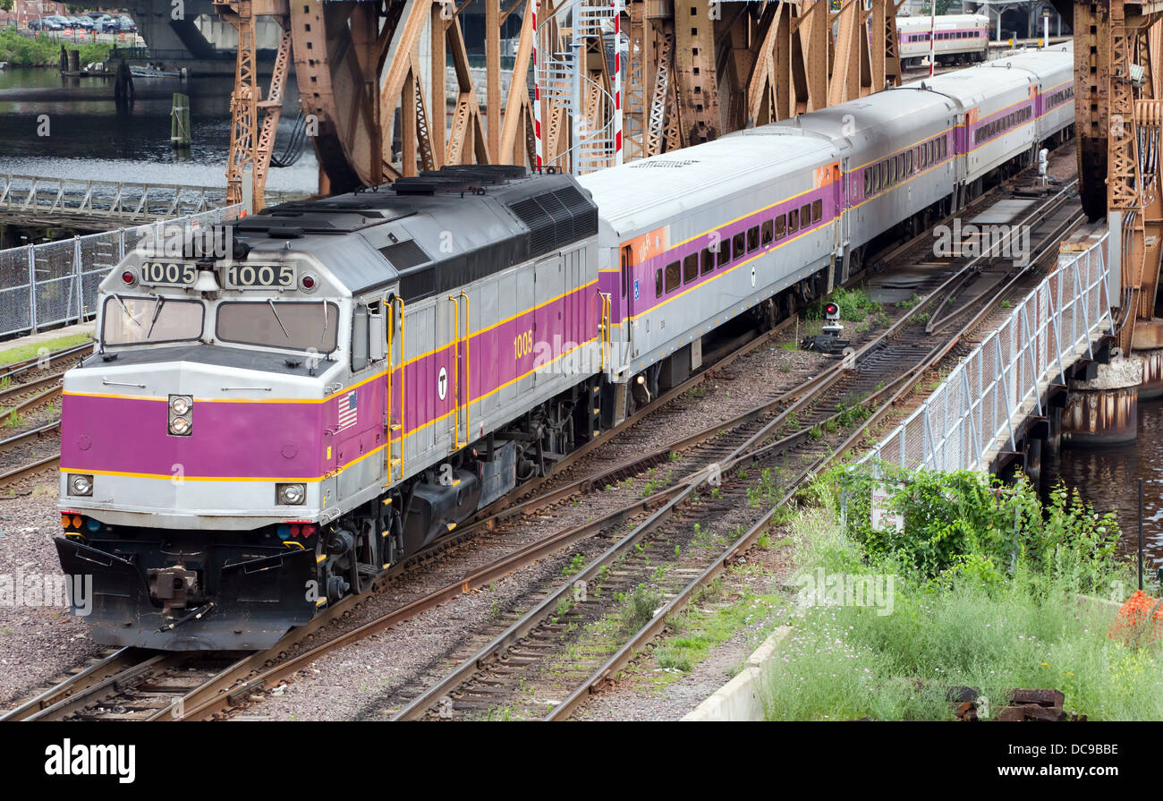 An MBTA commuter train leaving Bostons' North Station and passing over ...