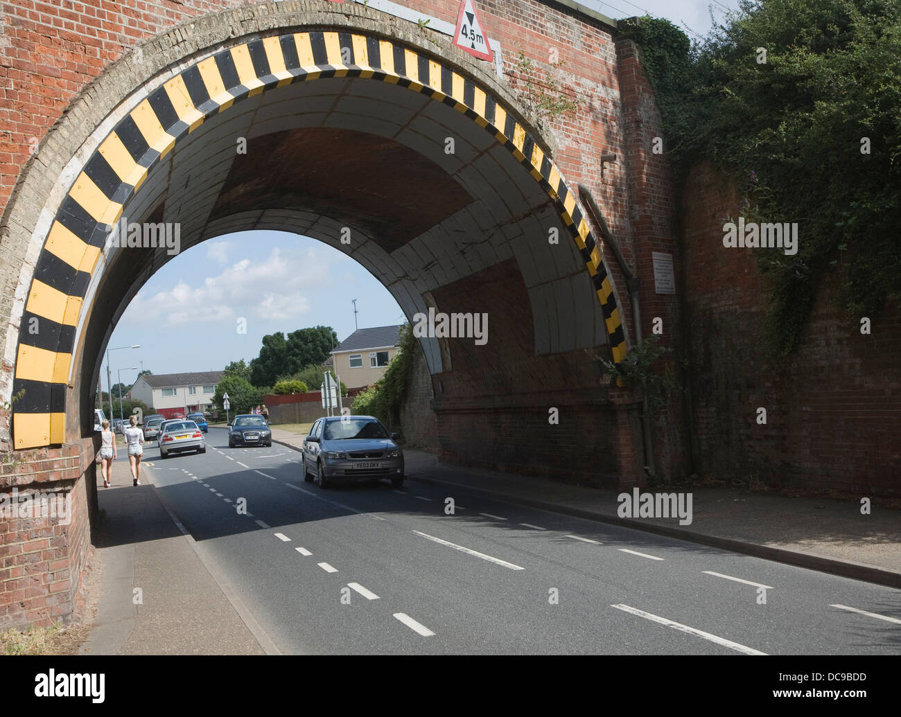 Road low bridge tunnel with hazard marking Lawford Essex England Stock ...
