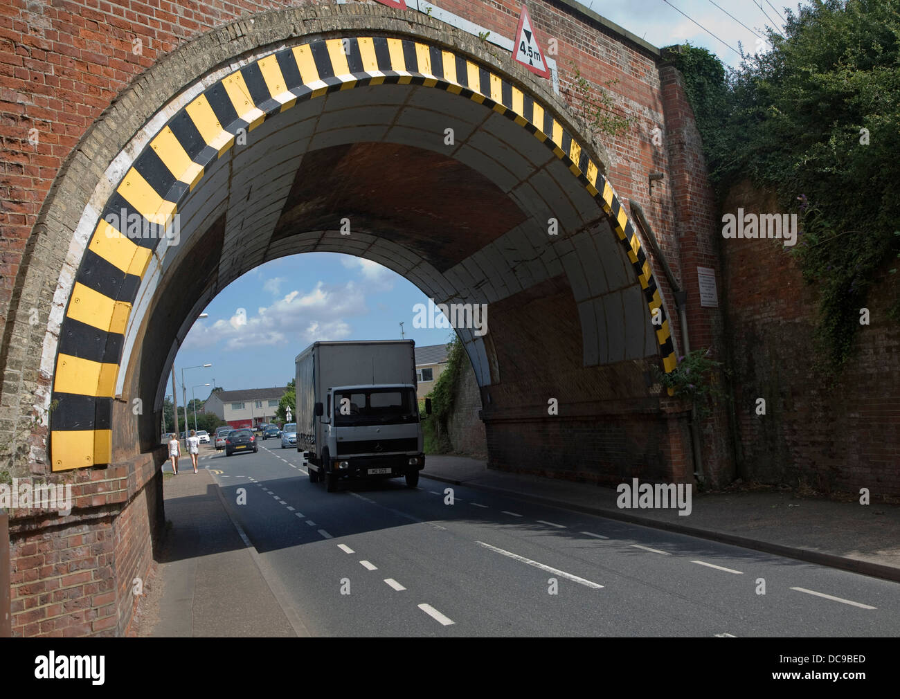 Road low bridge tunnel with hazard marking Lawford Essex England Stock ...