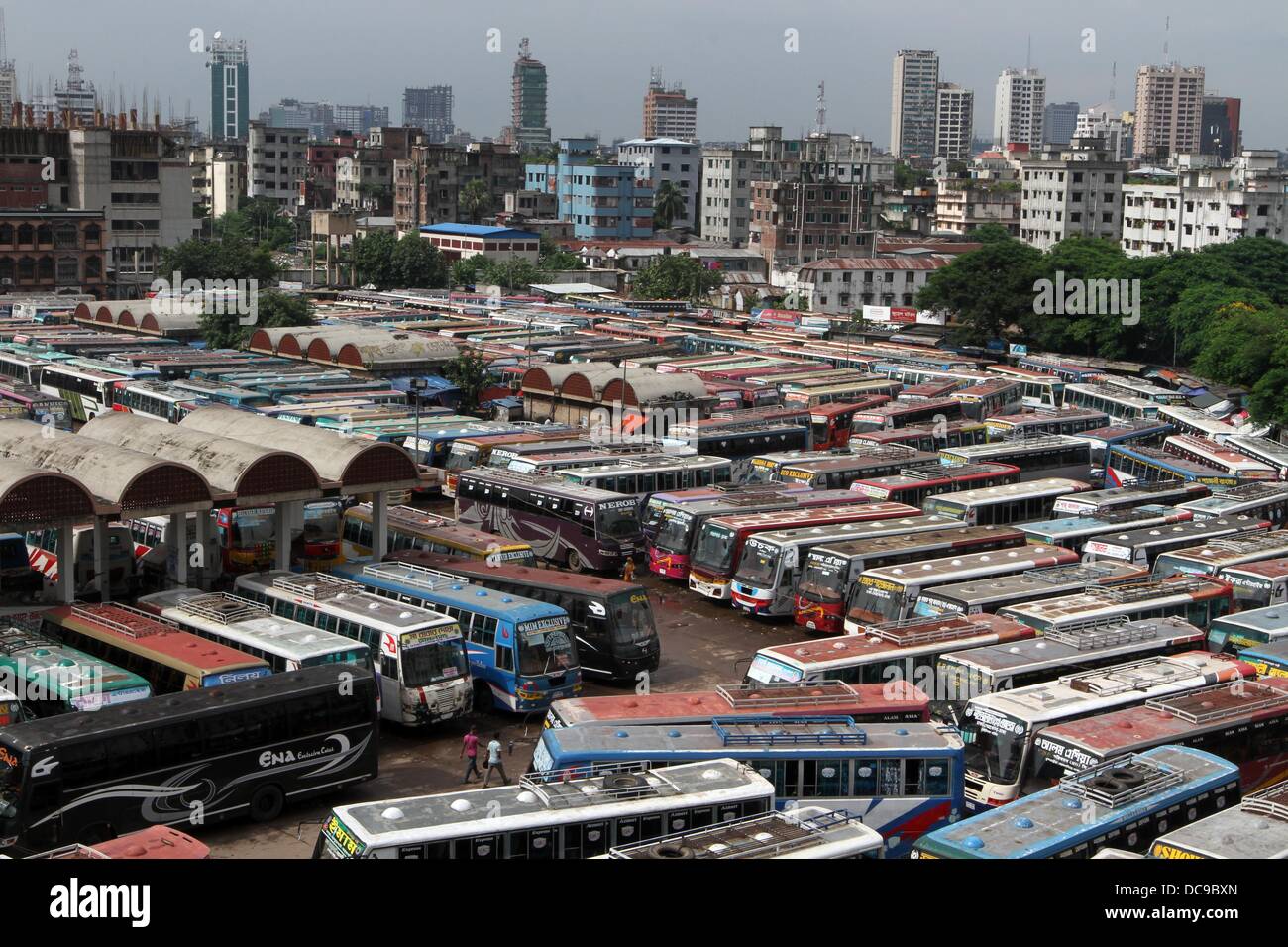 Dhaka, Bangladesh. 13th Aug, 2013. Buses are parked at an inter ...