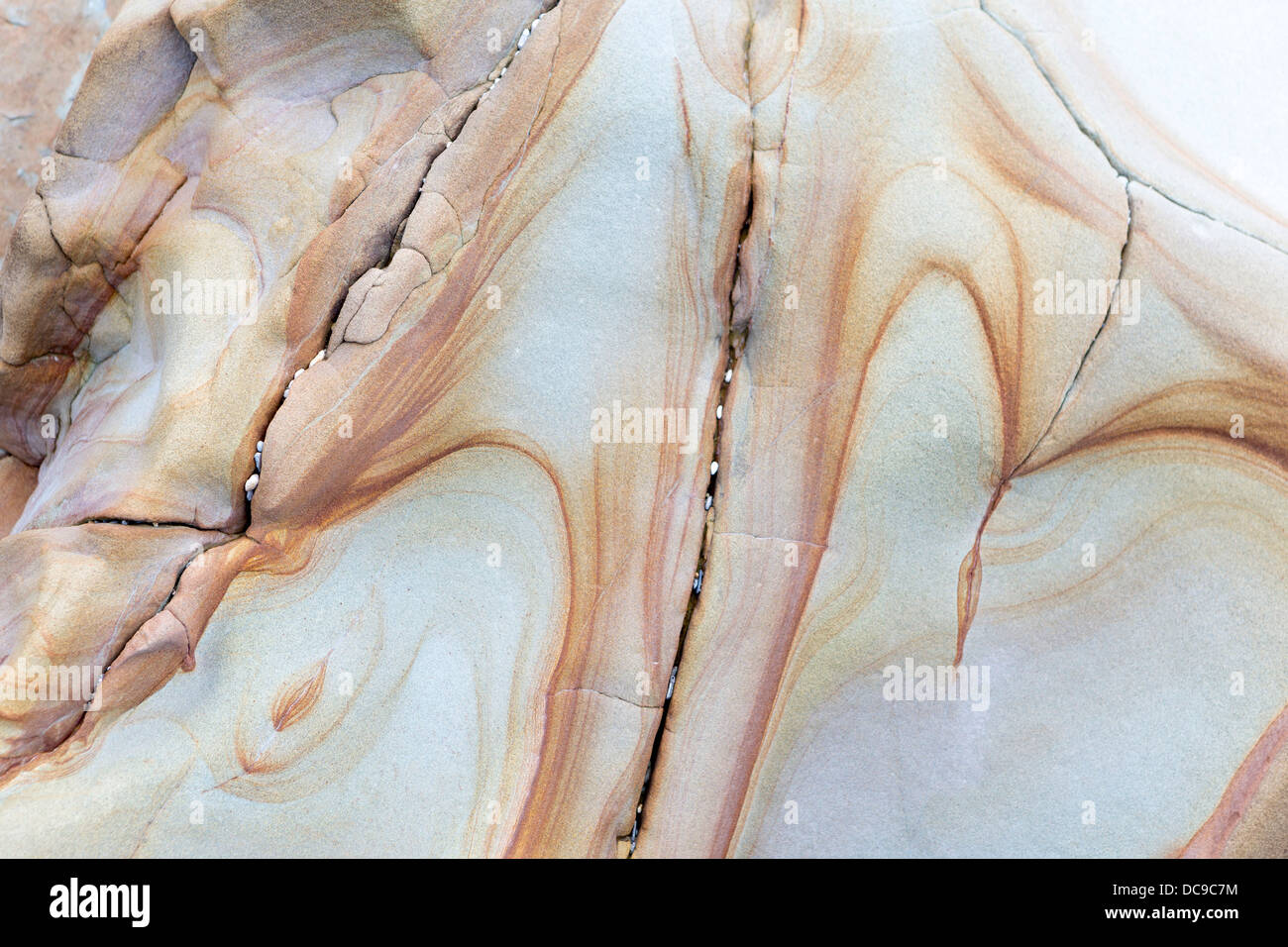 Colourful inclusions in a rock Stock Photo - Alamy