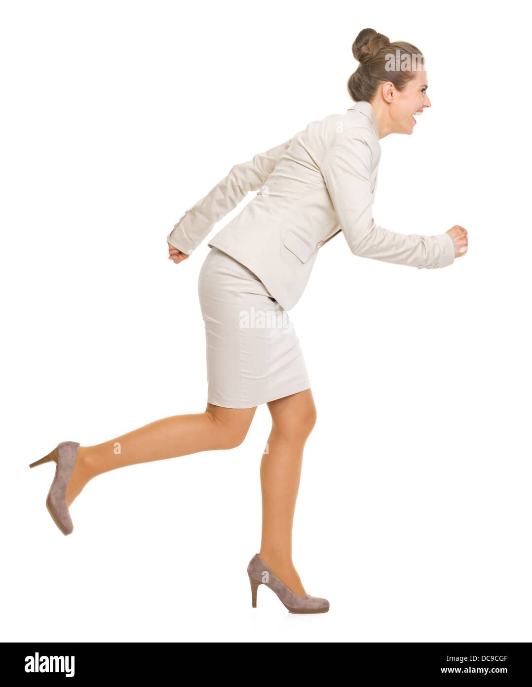 Full length portrait of business woman running sideways Stock Photo - Alamy