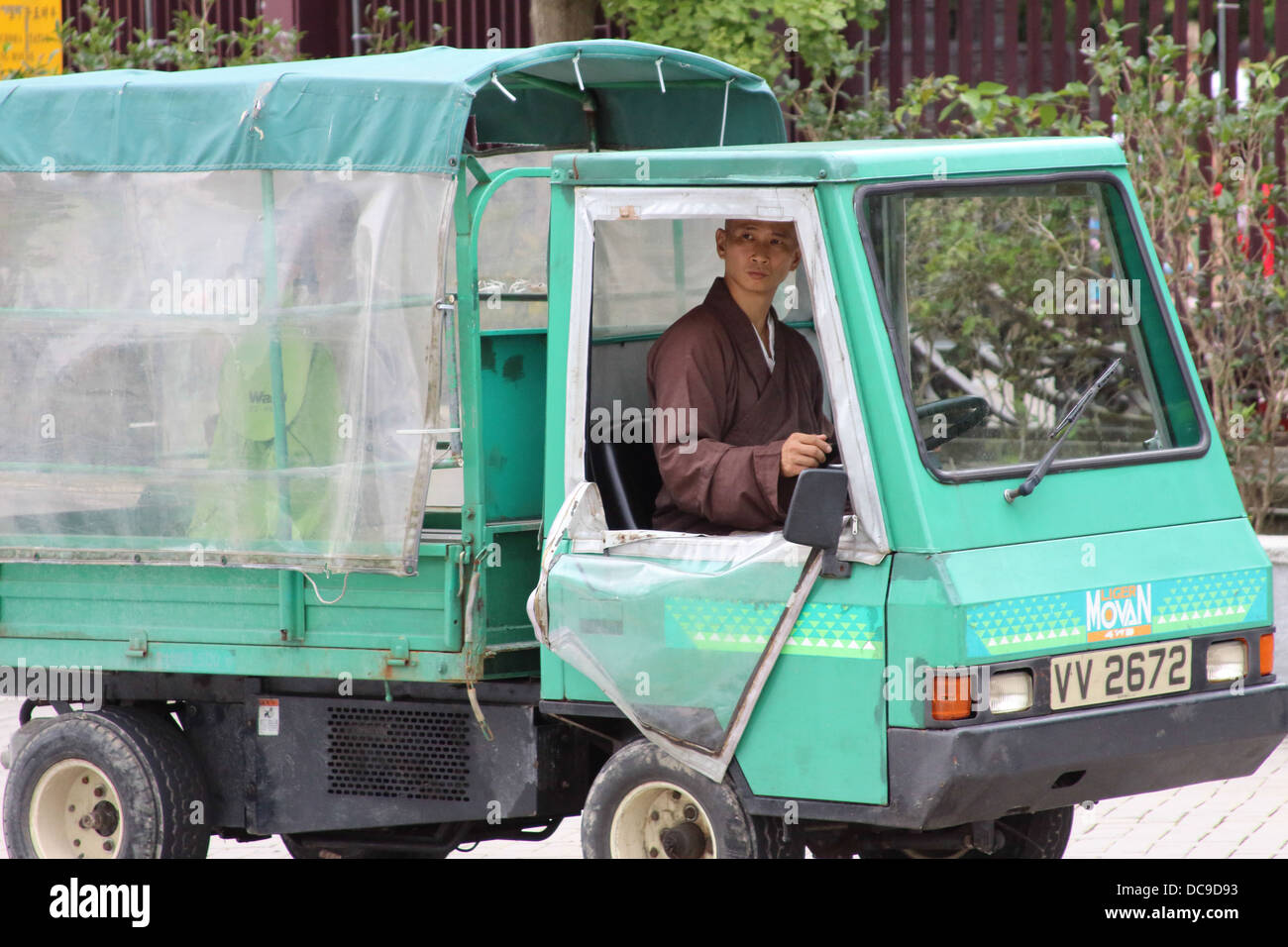 Monk driving a van at the site of The Big Buddha on Lantau Island Stock ...