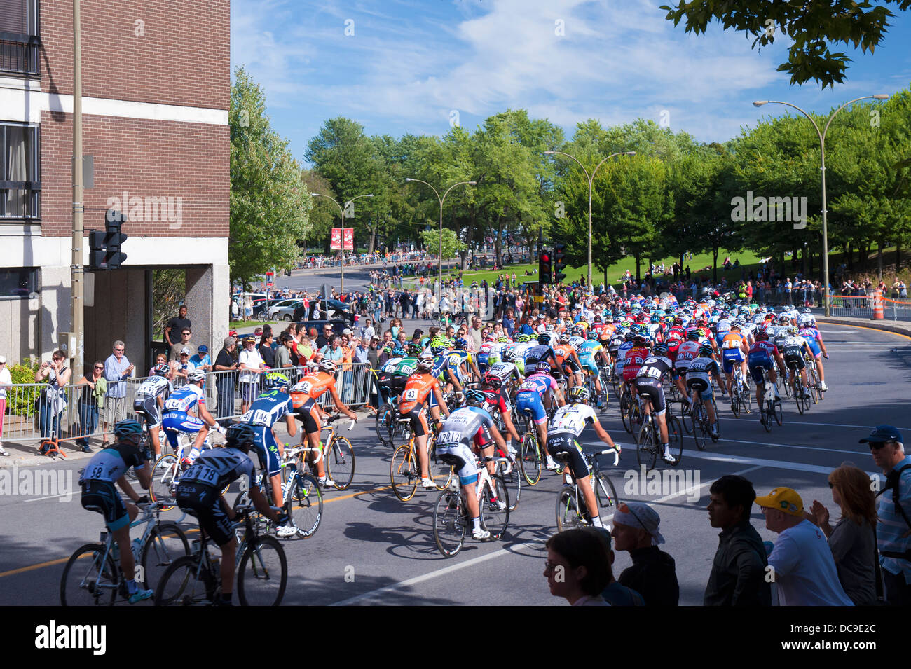 Peloton of professional cyclists competing for "Grand Prix Cycliste de ...