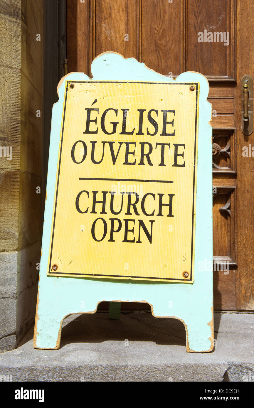 "Church open" bilingual sign at the entrance of a church Stock Photo ...