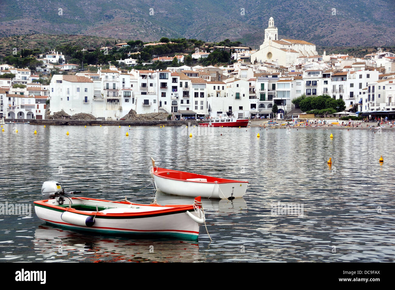 Aerial view of Cadaques, Spain with Cathedral, sea and Two Boats Stock ...
