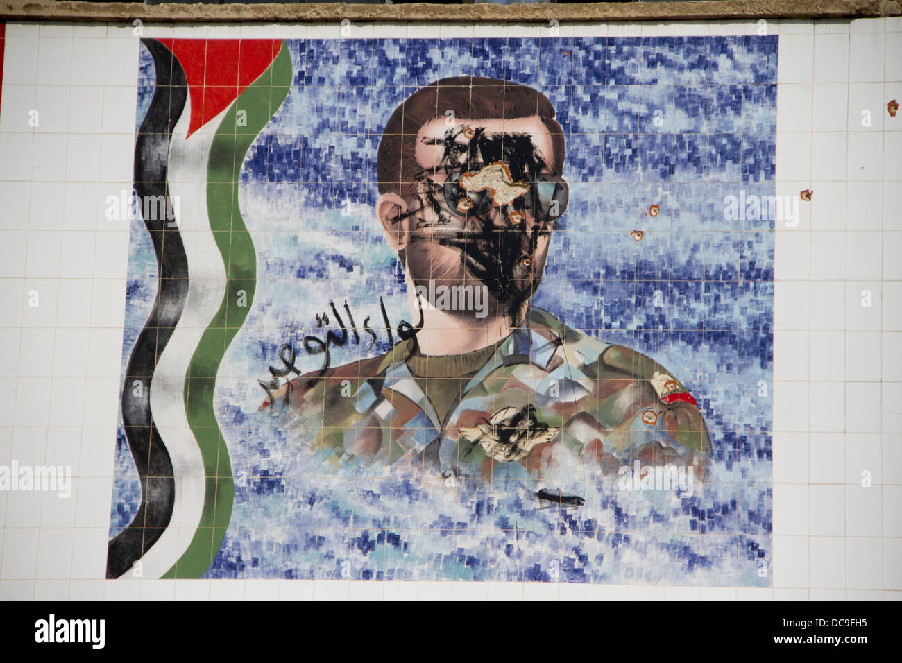 A defaced image of the Assad family in Aleppo, Syria Stock Photo - Alamy