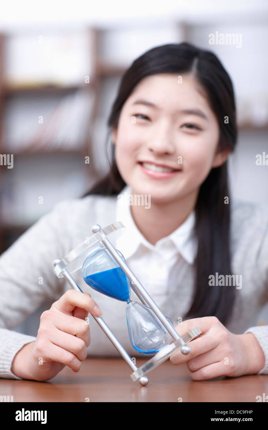 a student with sand hour glass Stock Photo - Alamy