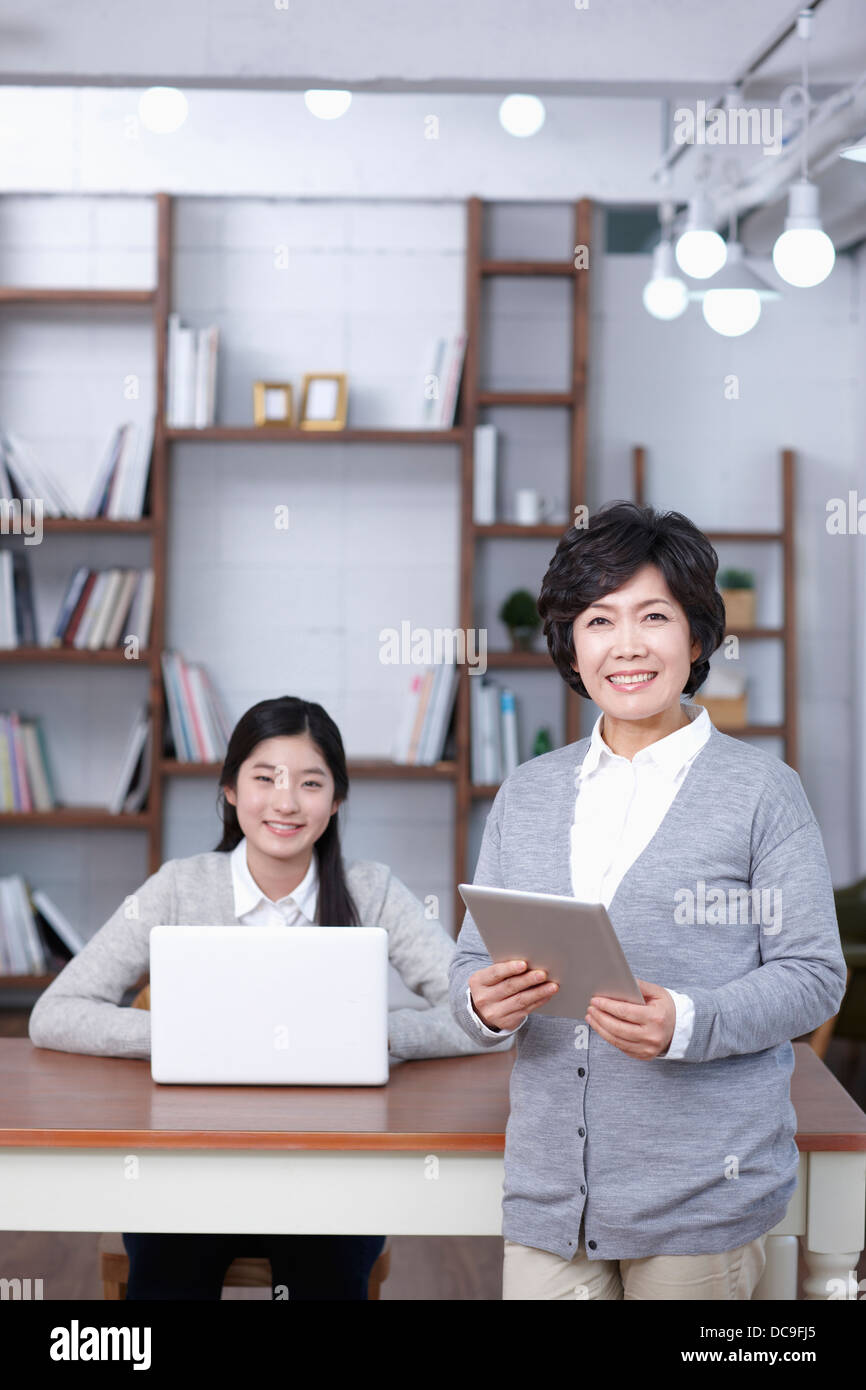 mother and daughter in study room Stock Photo - Alamy
