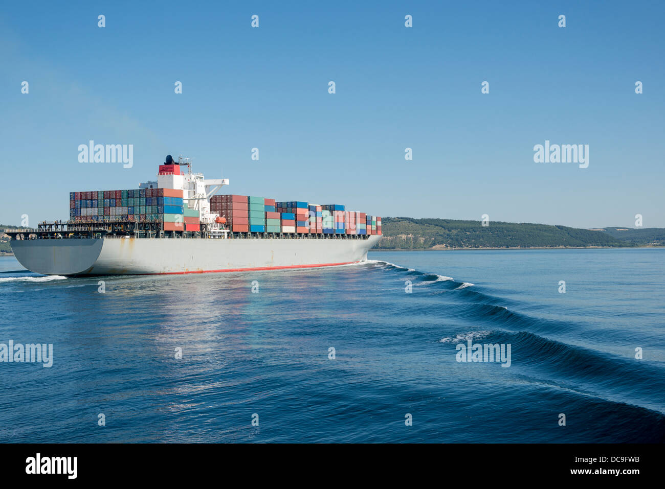 Container ship heading out to sea Stock Photo - Alamy