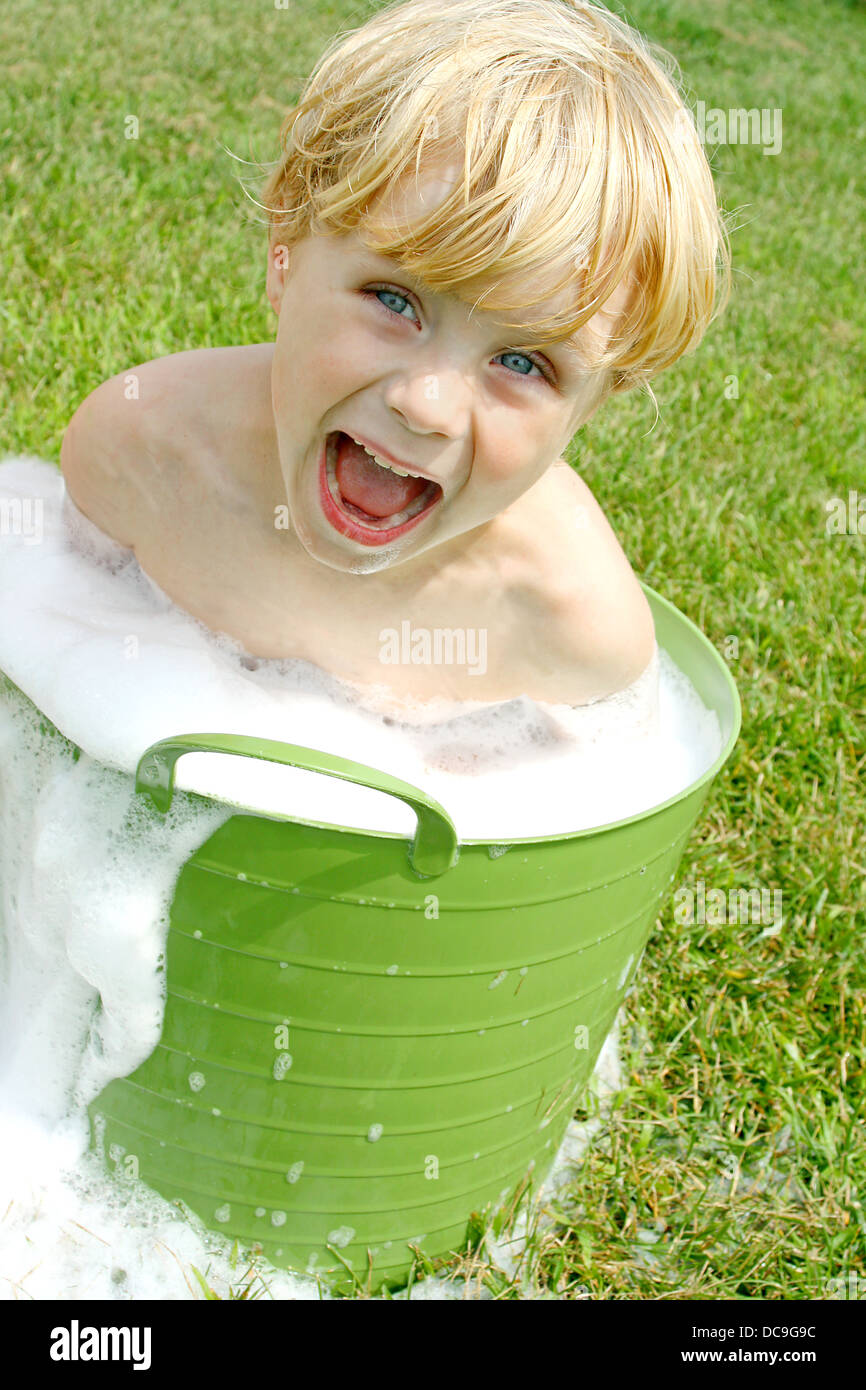 Child in bucket hi-res stock photography and images - Alamy