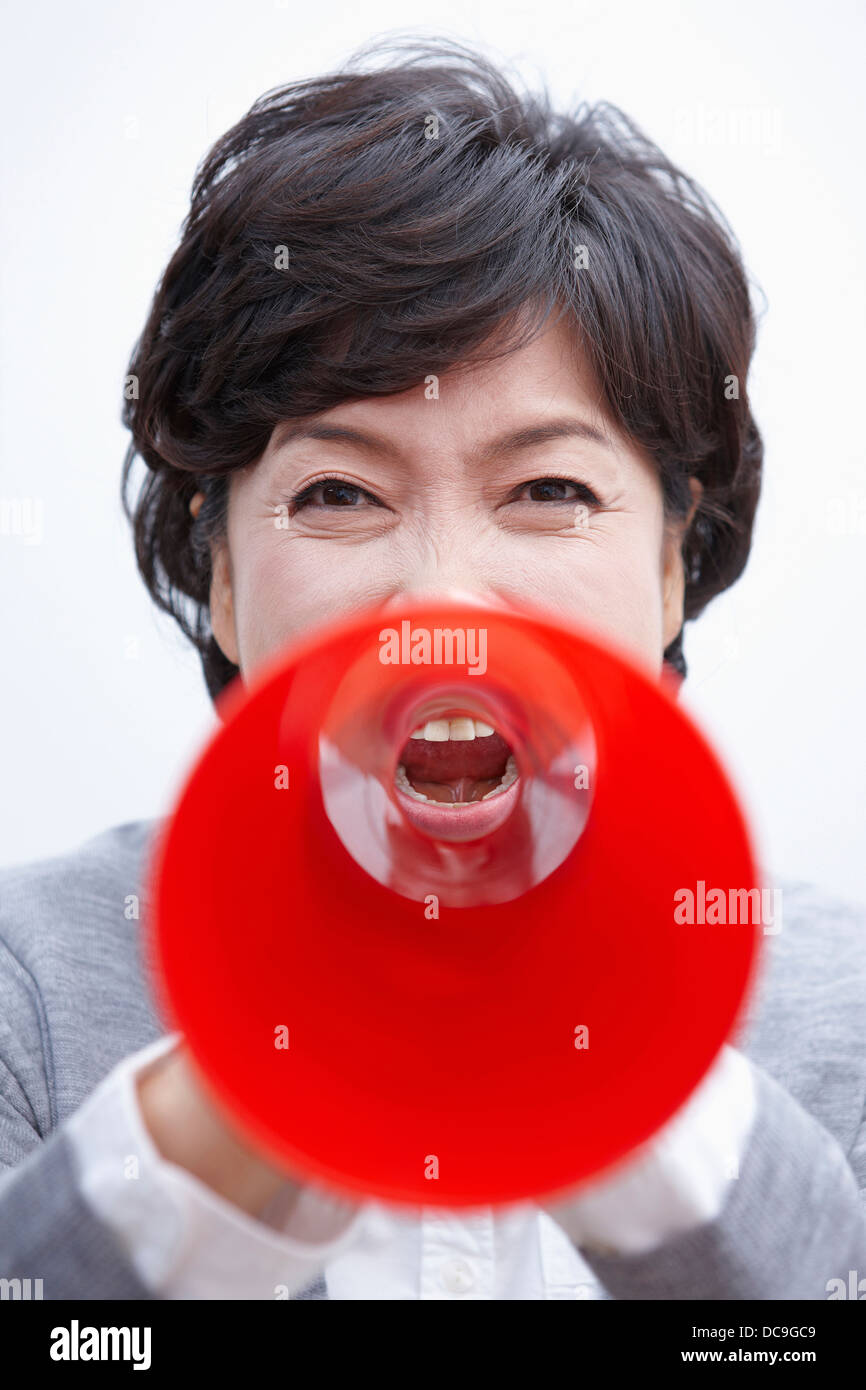close up shot of a mother scolding with megaphone Stock Photo - Alamy